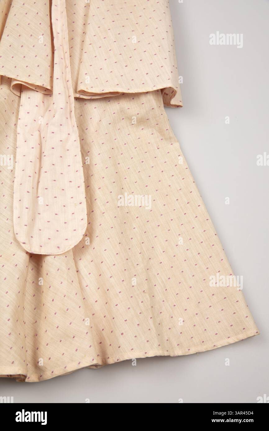 This dress, made of light pink cotton with dark pink Swiss dots, was ...