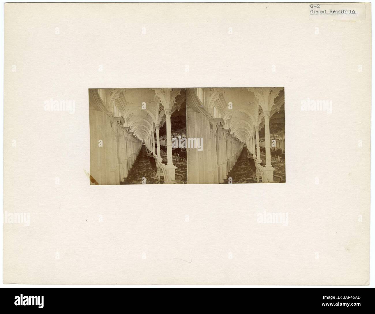 Two black and white photographs forming a stereograph depict an aisle ...