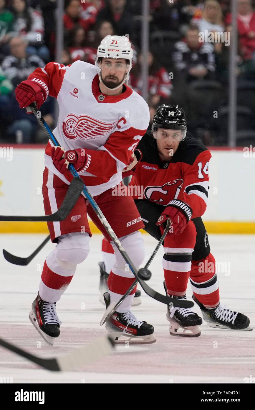 Detroit Red Wings' Dylan Larkin, left, and New Jersey Devils' Nathan ...