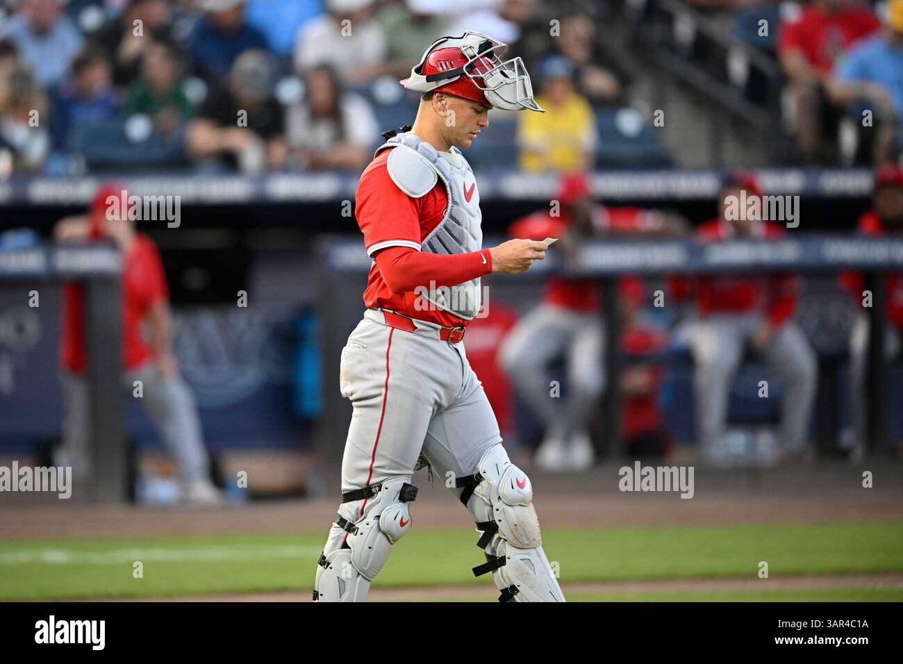 Los Angeles Angels catcher Logan O'Hoppe walks to the pitching mound during the first inning of ...