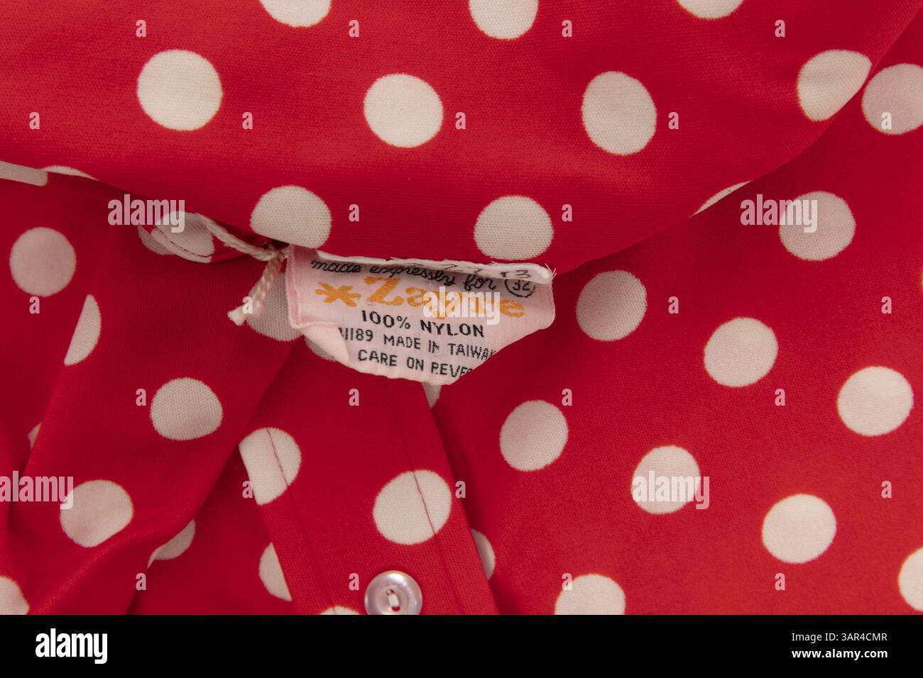 A red polka dot shirt worn by members of the Welders, one of the ...