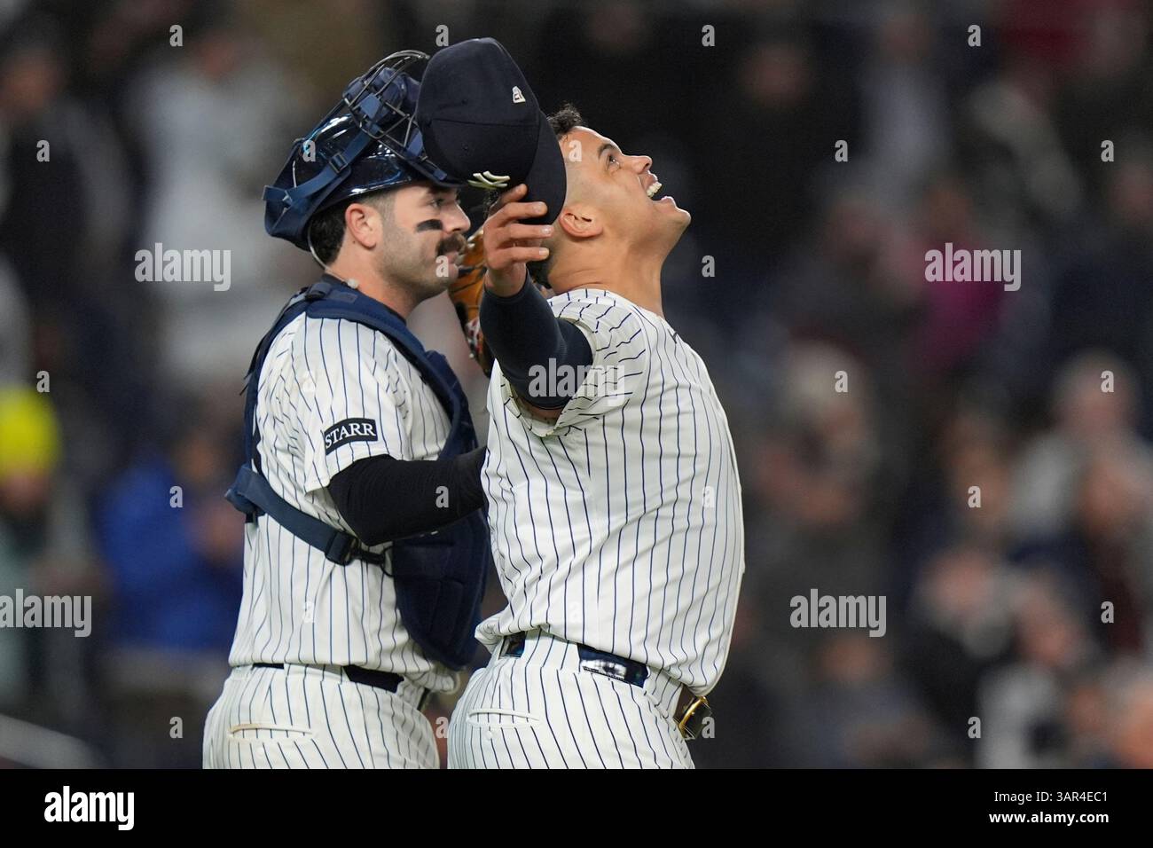 New York Yankees pitcher Fernando Cruz, right, and catcher Austin Wells ...