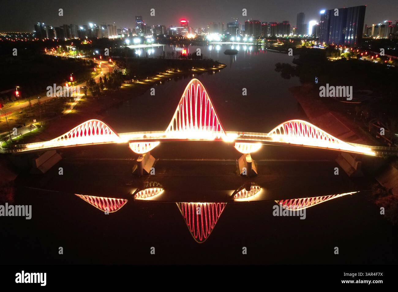 Xianyang,China.15th April 2025. Pingsha Luoyan Bridge Spanning the Feng ...