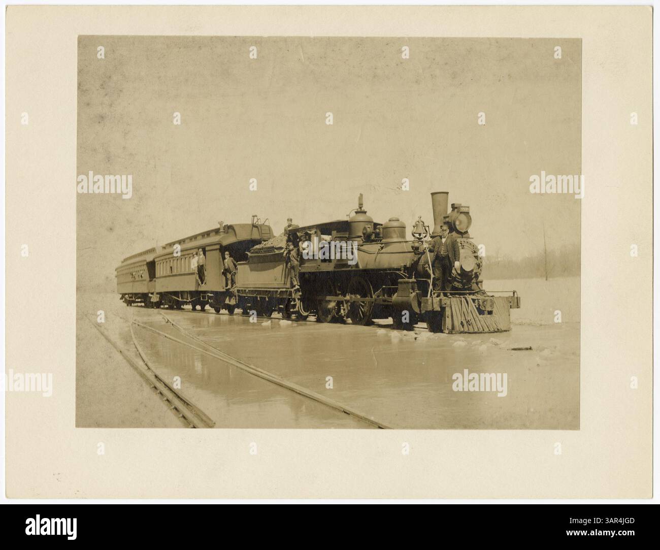 This black and white photograph from April 1912 depicts a train ...
