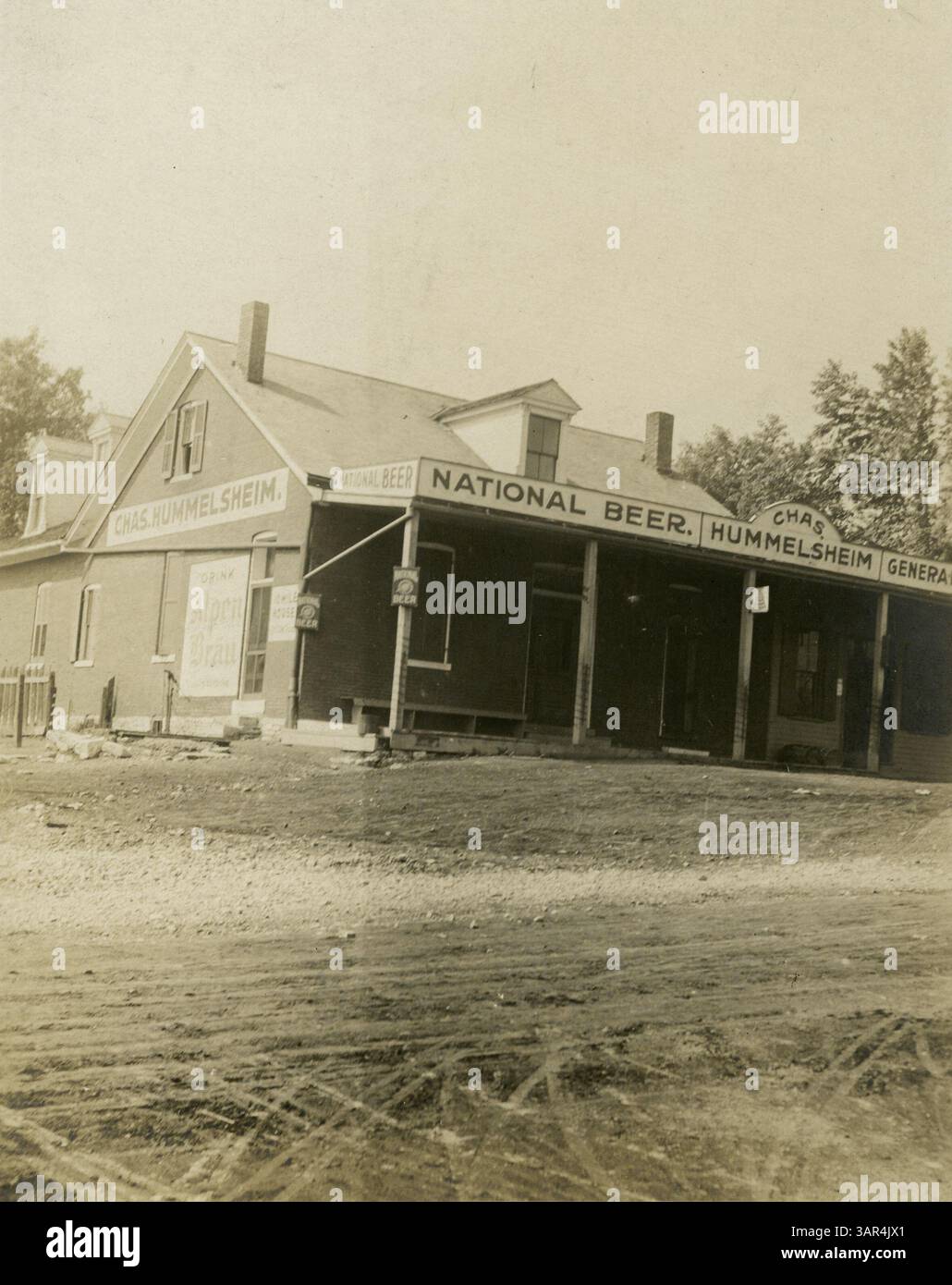 A vertical black and white photograph showing the front and left side ...