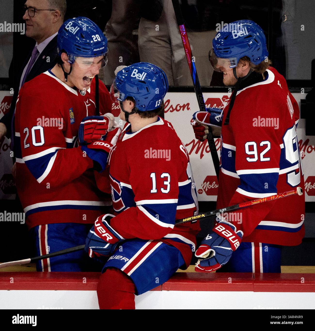 Montreal Canadiens' Juraj Slafkovsky (20), Cole Caufield (13) and Patrik Laine (92) celebrate ...