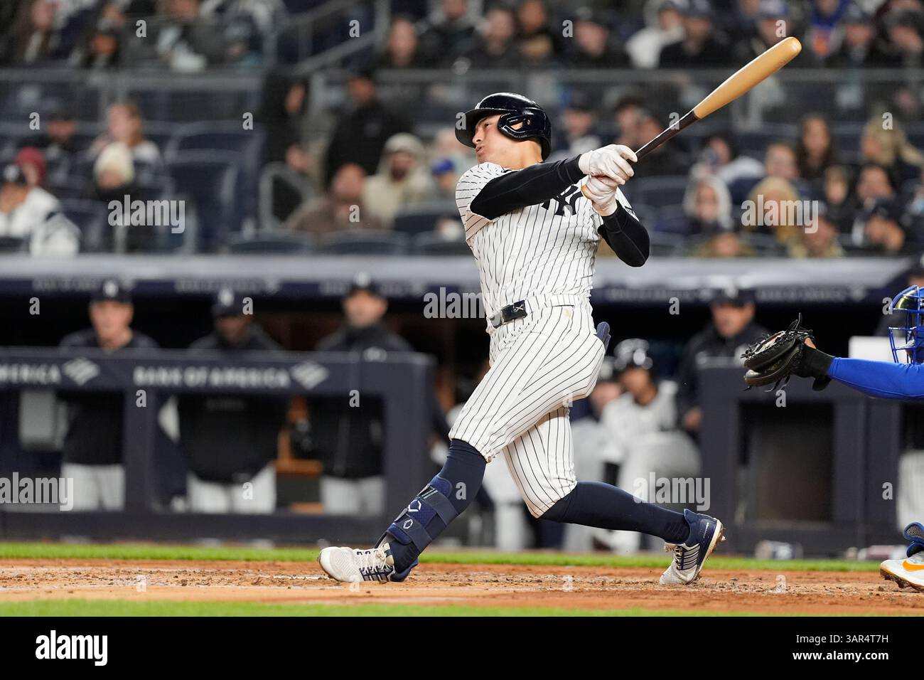 BRONX, NY - APRIL 16: New York Yankees Shortstop Anthony Volpe (11) hits an RBI double during ...