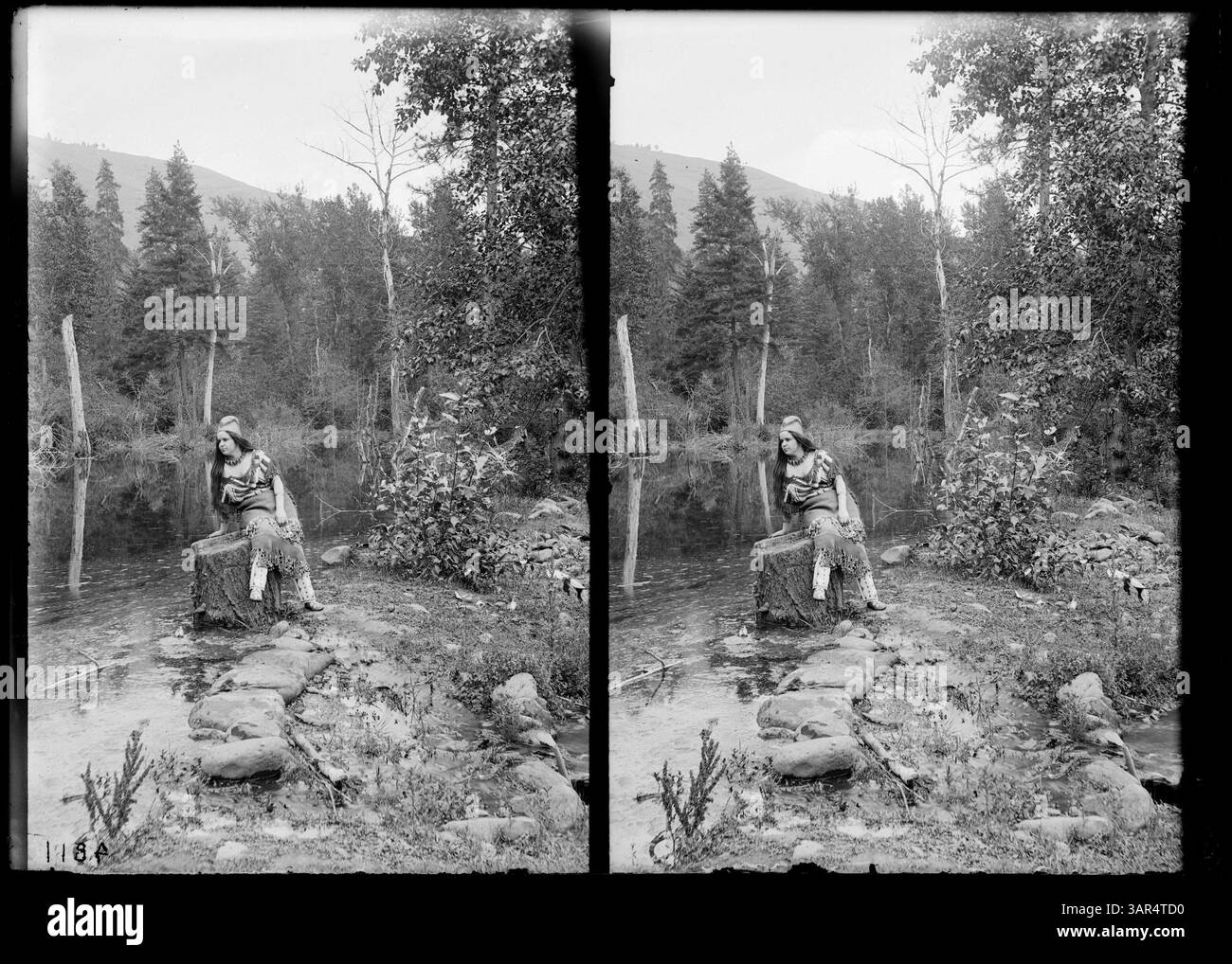 This photograph shows a tribal girl posing in full regalia at Bingham ...