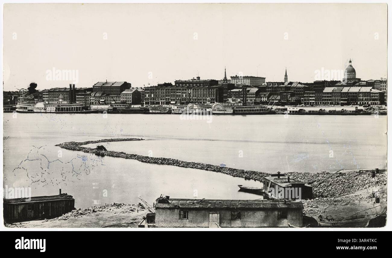 This black-and-white photograph captures the St. Louis Levee, with ...