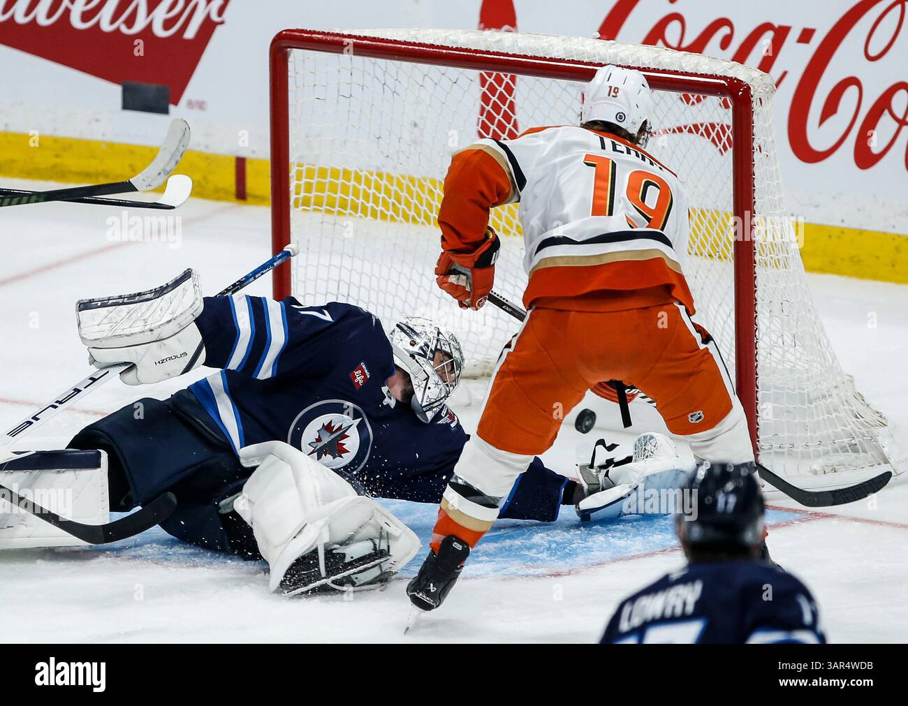 Anaheim Ducks' Troy Terry (19) scores the game-tying goal as Winnipeg ...