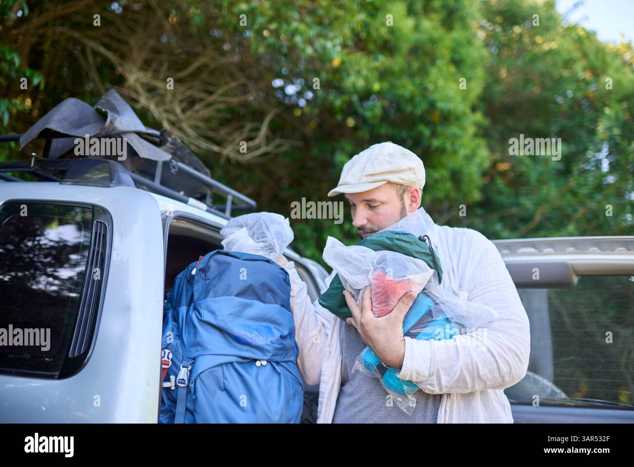 Adult man arranging camping gear hi-res stock photography and images ...
