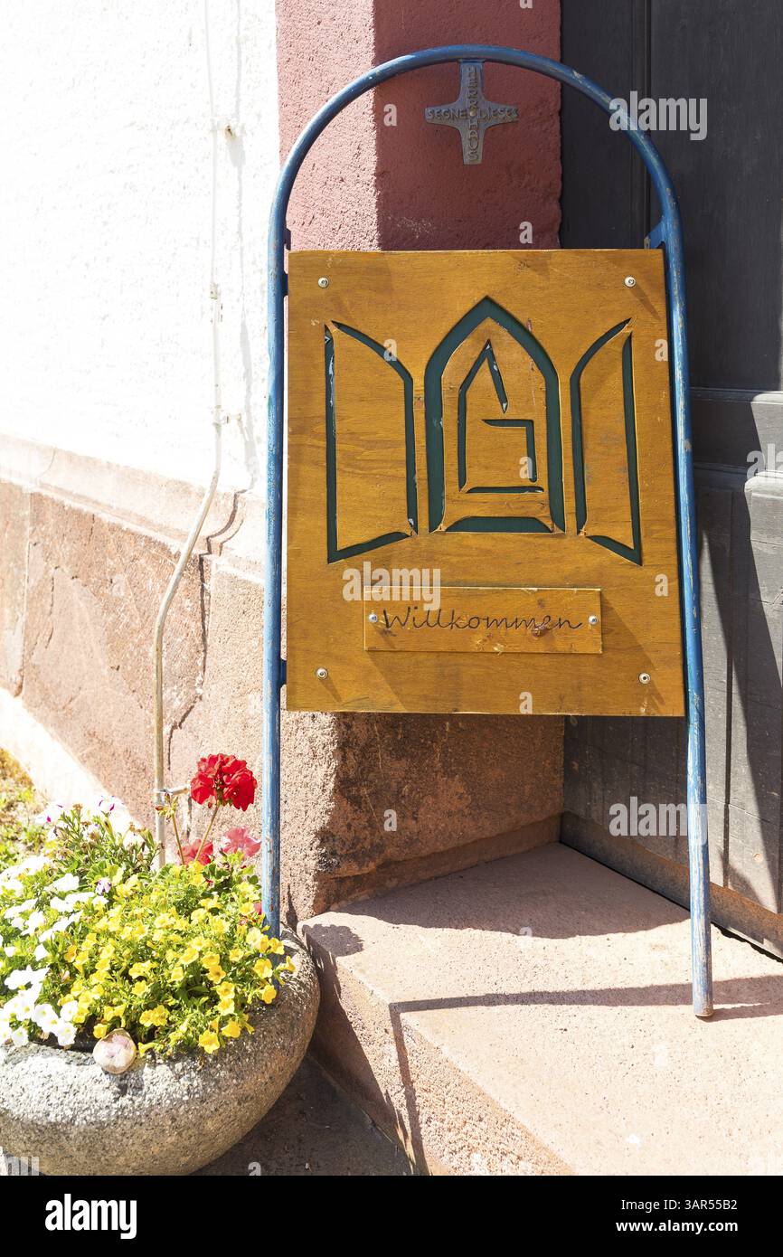 Welcome on a sign at the entrance to the Protestant church of St Otto ...