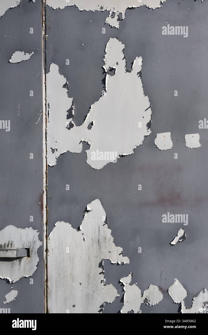 White paint chipped off grey metal door, Germany, Europe Stock Photo ...