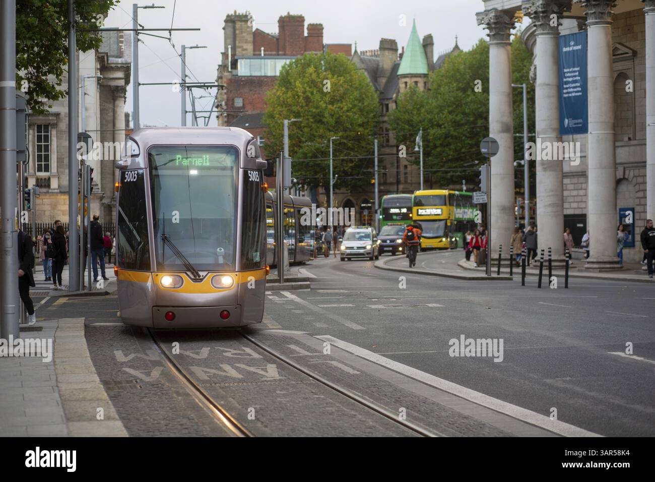 A Luas tram passes through the city centre near Trinity College on an ...