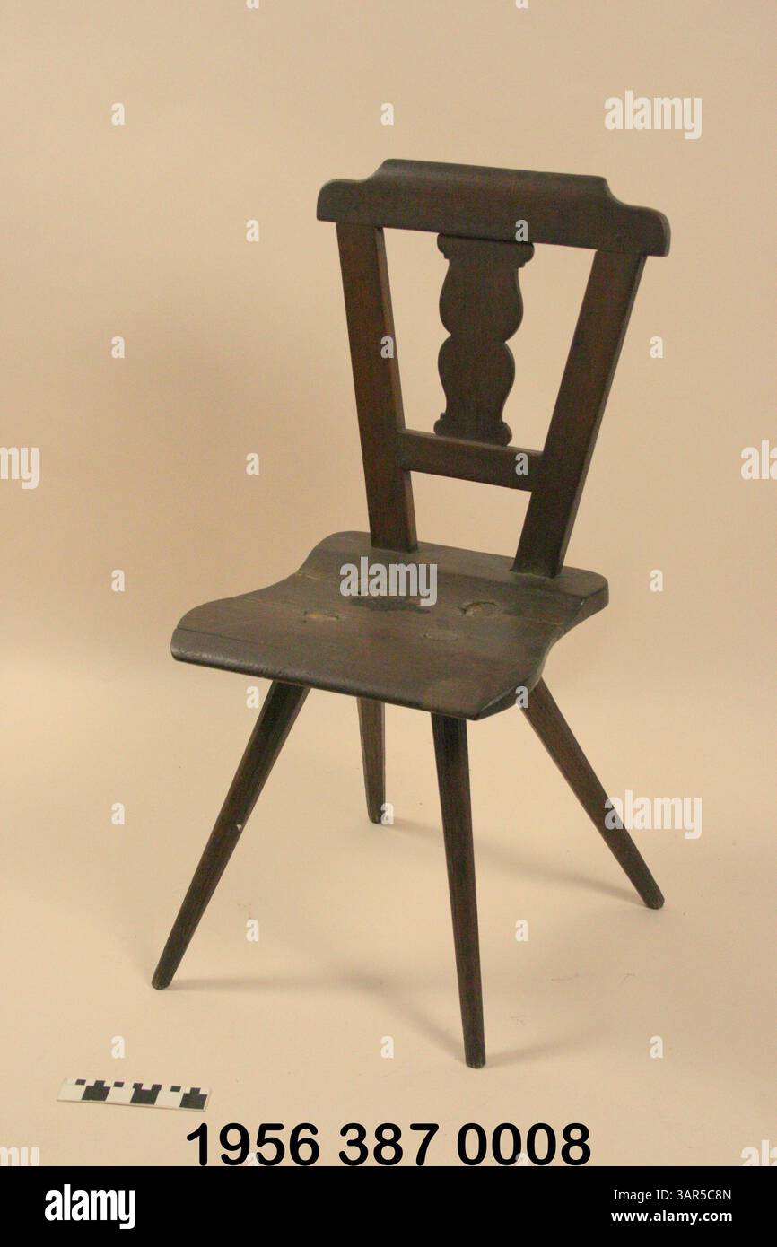 This German Alpine style side chair is made of walnut and features peg ...