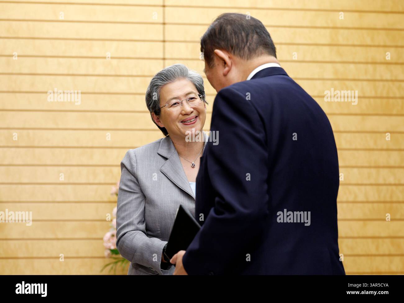 Japanese Prime Minister Shigeru Ishiba, right, welcomes AMD Chair and ...