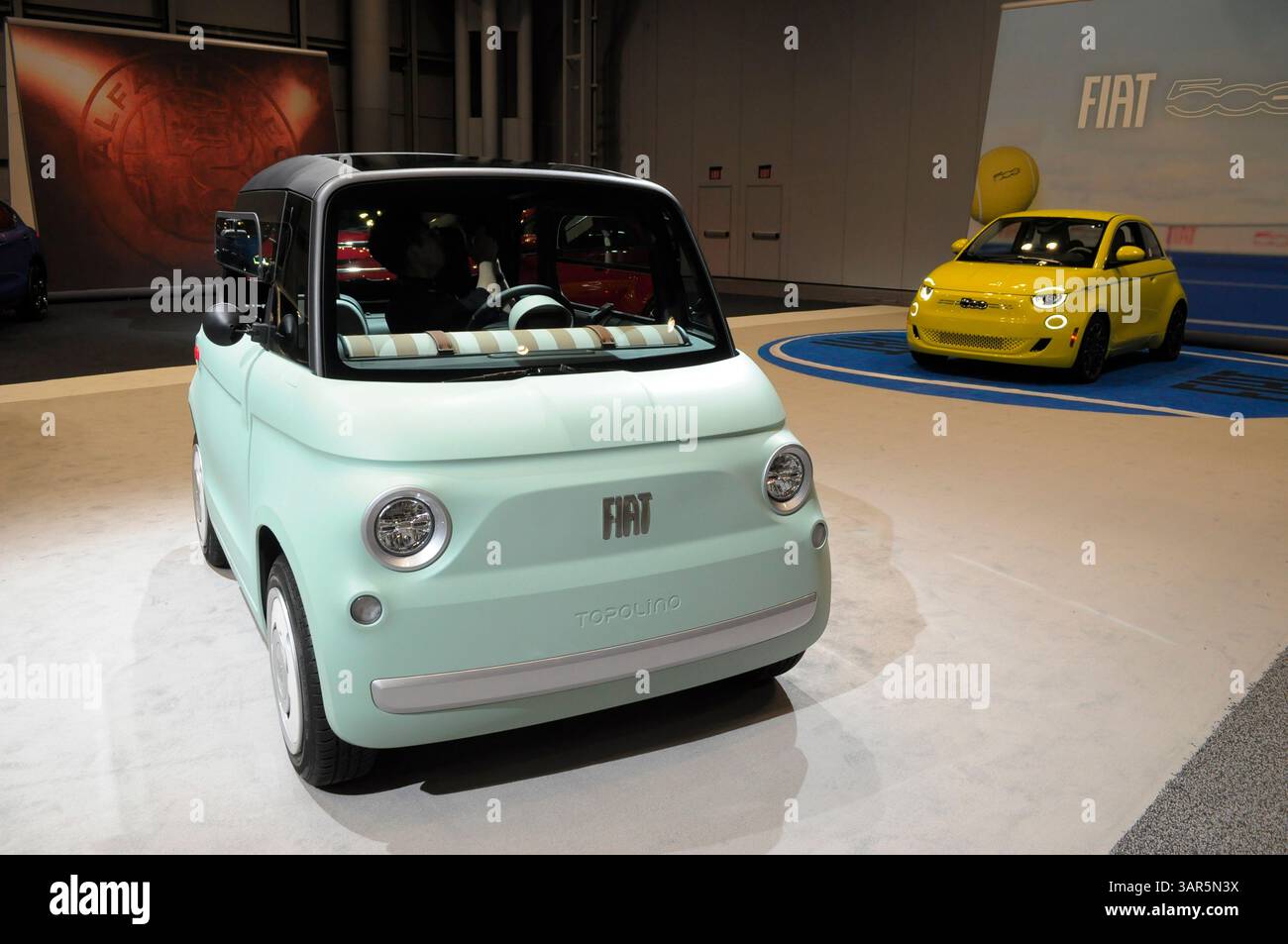 A Fiat Topolino vehicle (L) seen on media day at the 2025 New York ...