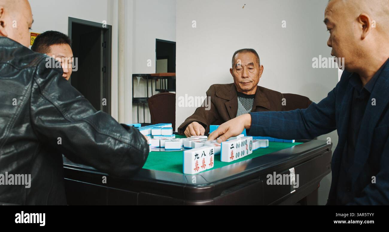 Chengdu, Sichuan, China. Men Playing Mahjong At Automatic Mahjong Table ...