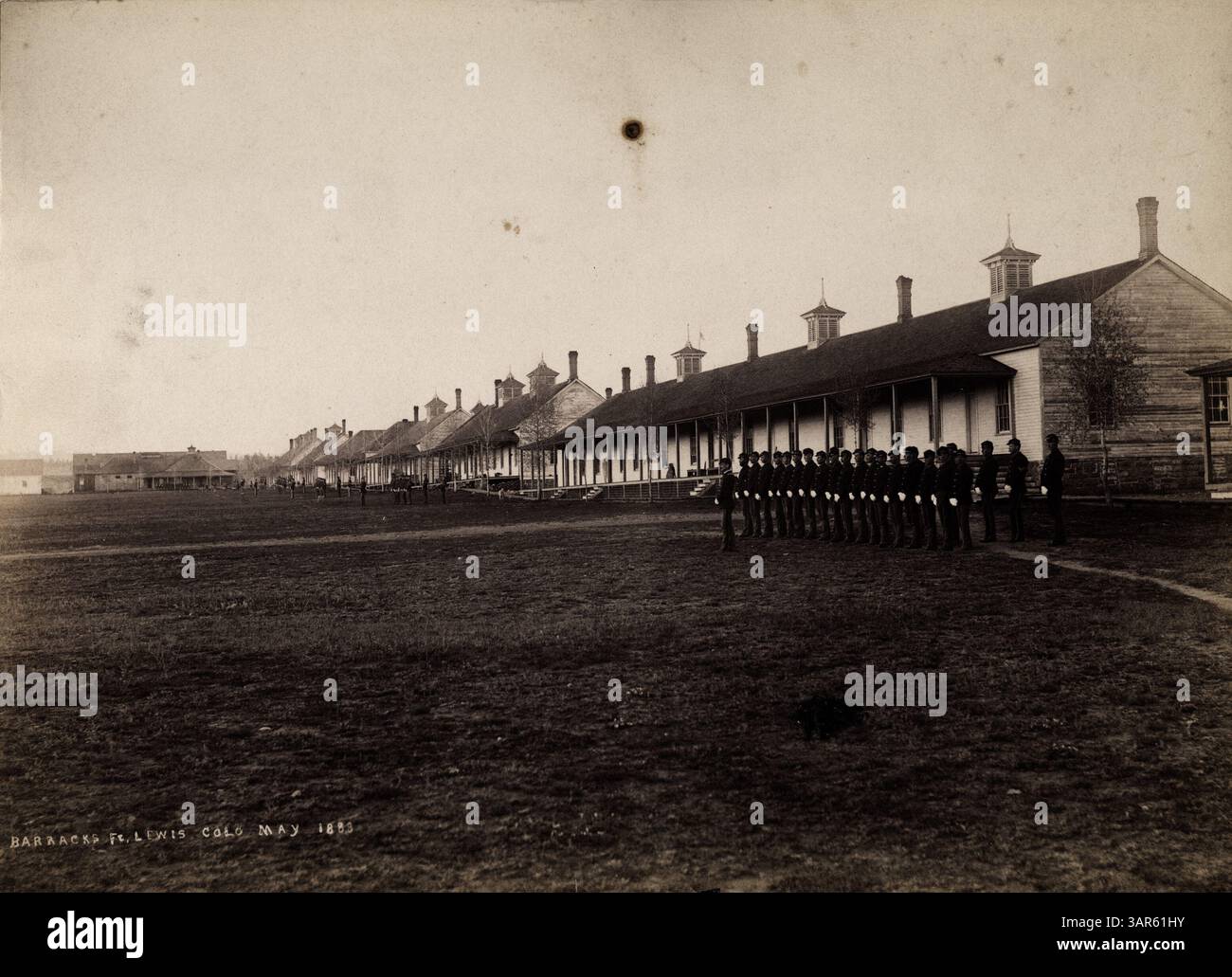 This photograph by Frazier A. Boutelle shows military units lined up in ...
