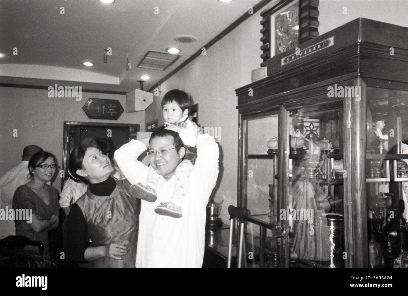 Chinese Family Gathering in Traditional Restaurant – Early 2000s Urban ...
