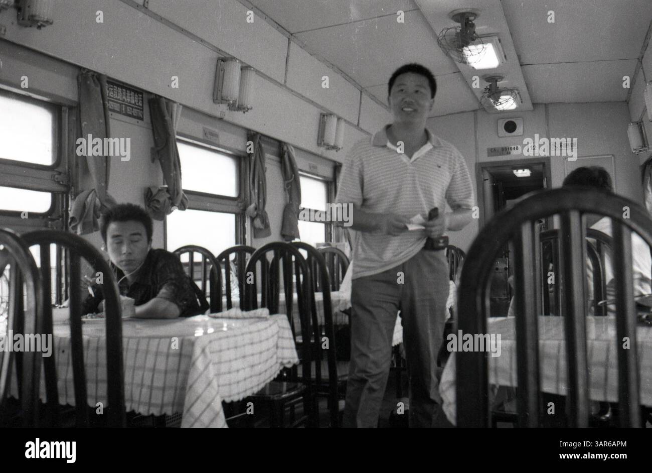 Traveling through time in a vintage train dining car filled with ...