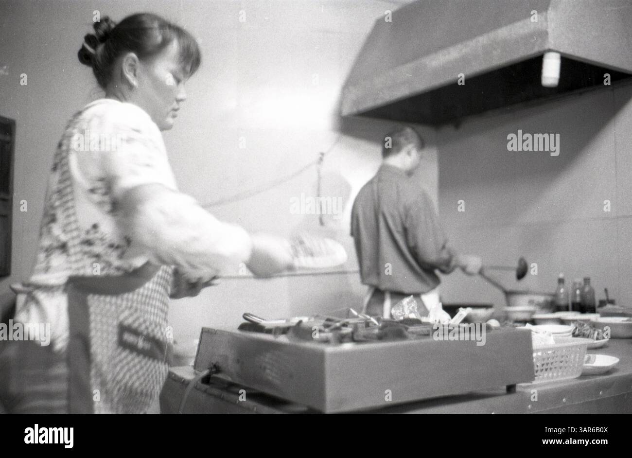 Man and Woman Cooking Together in a Chinese Kitchen - Early 2000s ...