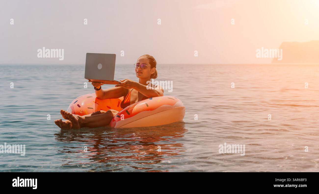 Woman Laptop Beach: Relaxing on Inflatable Raft, Working Remotely ...