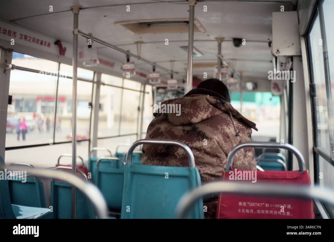 Quiet moments on a city bus during the late afternoon, capturing ...