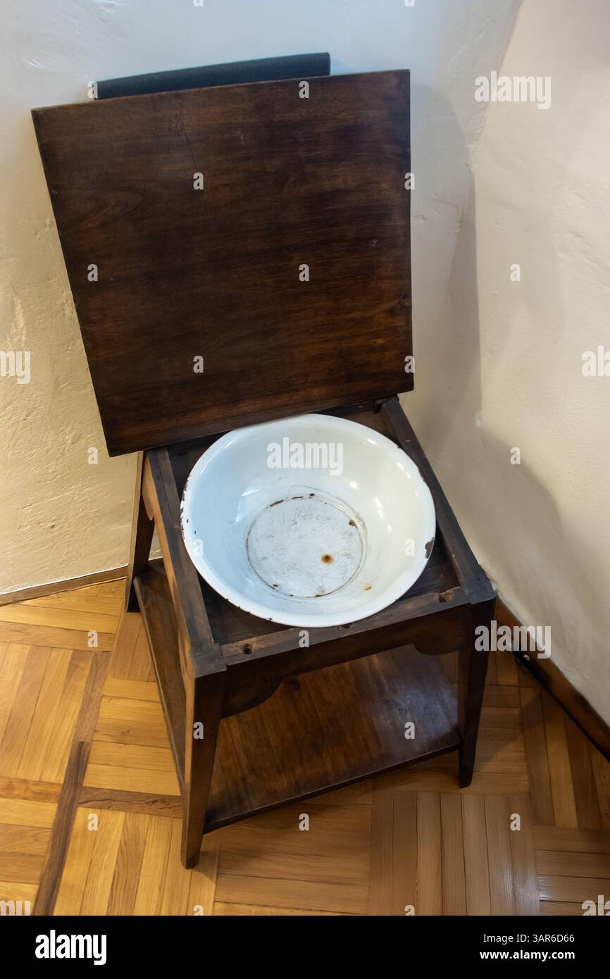An old washbowl installed in a historical table with an open lid Stock ...