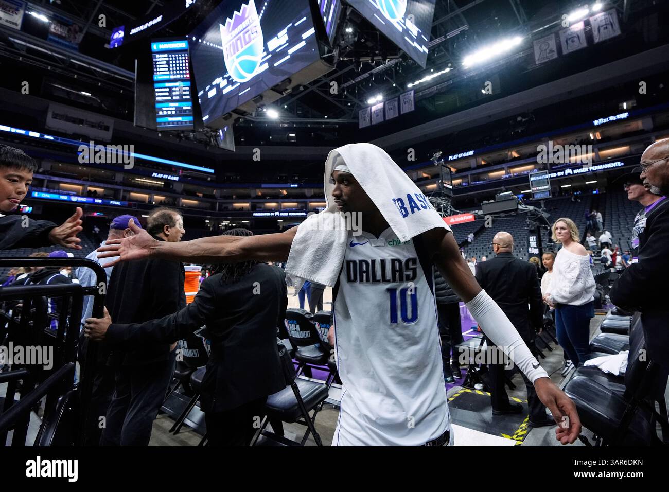 Dallas Mavericks guard Brandon Williams (10) shakes hands with a young ...