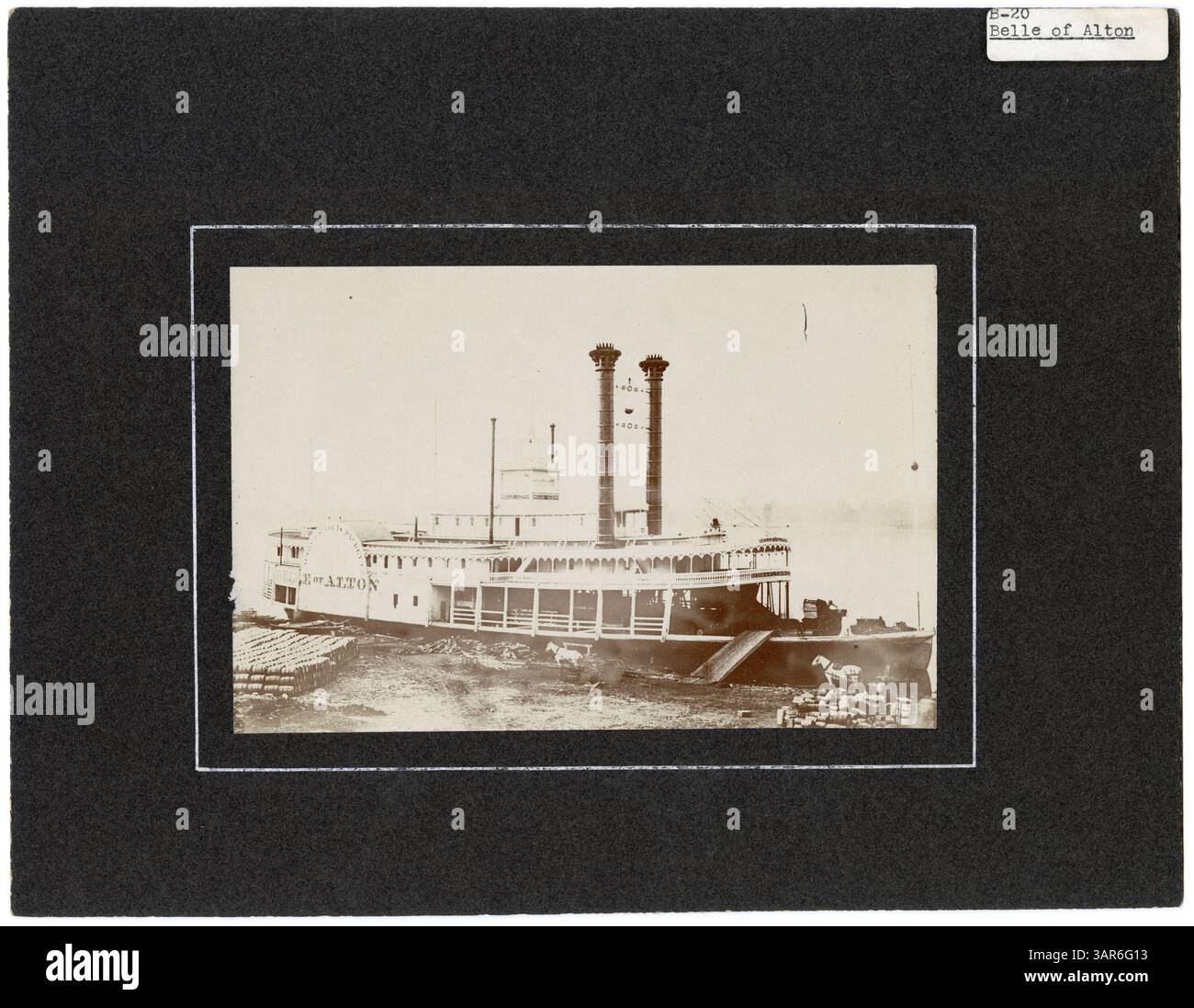 The steamboat Belle of Alton, docked along the riverbank, with horse ...