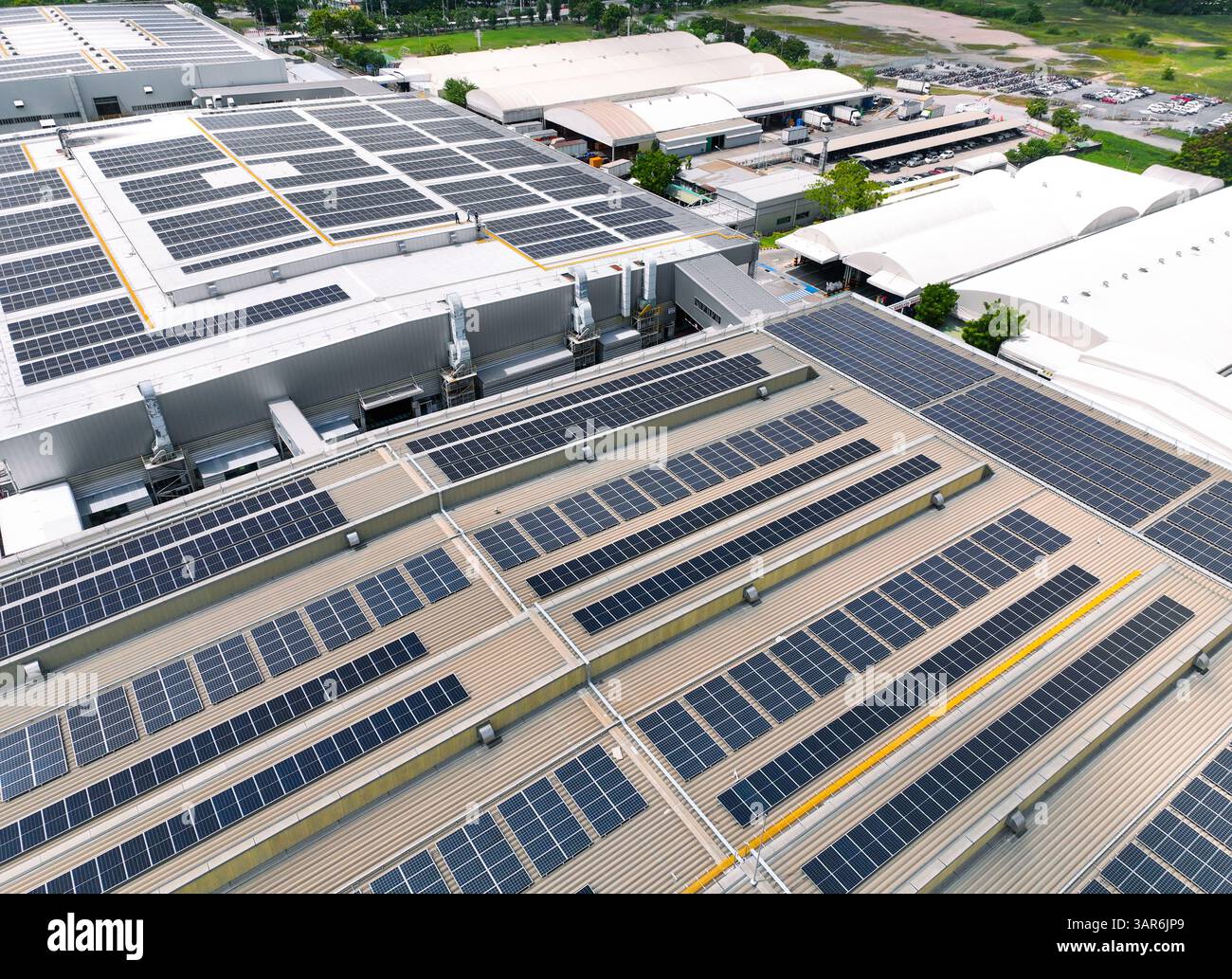 Solar-powered warehouse facility. Modern distribution center with ...
