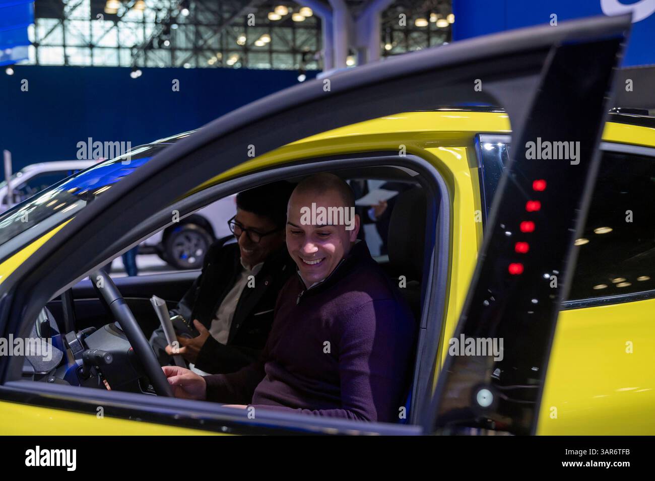 NEW YORK, NEW YORK - APRIL 16: People look at the new 2026 Ford Mustang ...