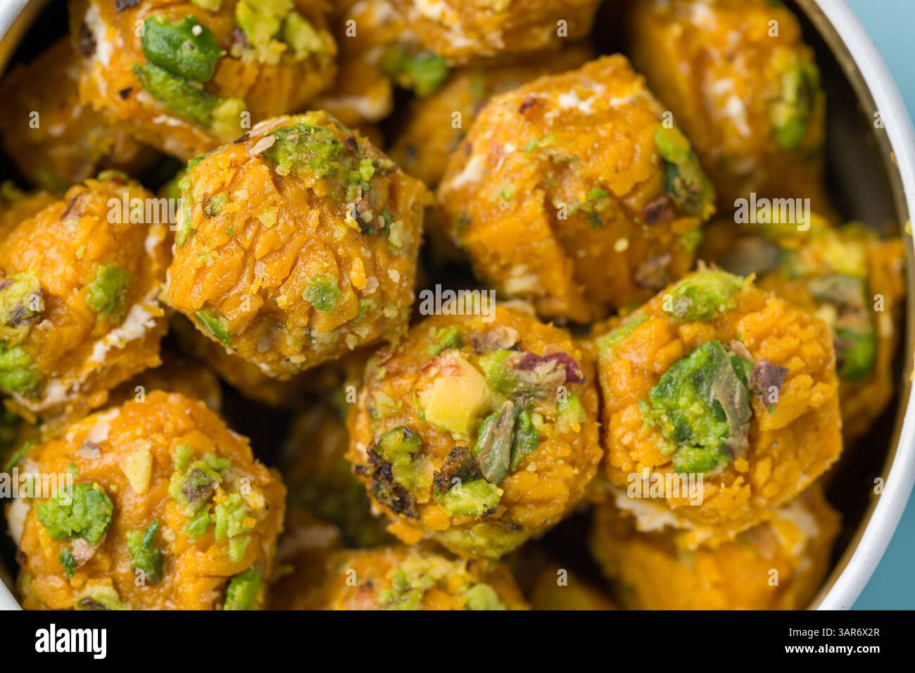 Sohan Dessert, the traditional famous Iranian dessert on a blue ...