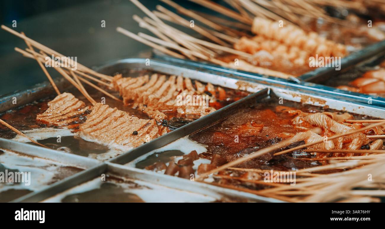 Traditional Chinese Meat Snacks On Bamboo Sticks. Fried Squid, Meat ...