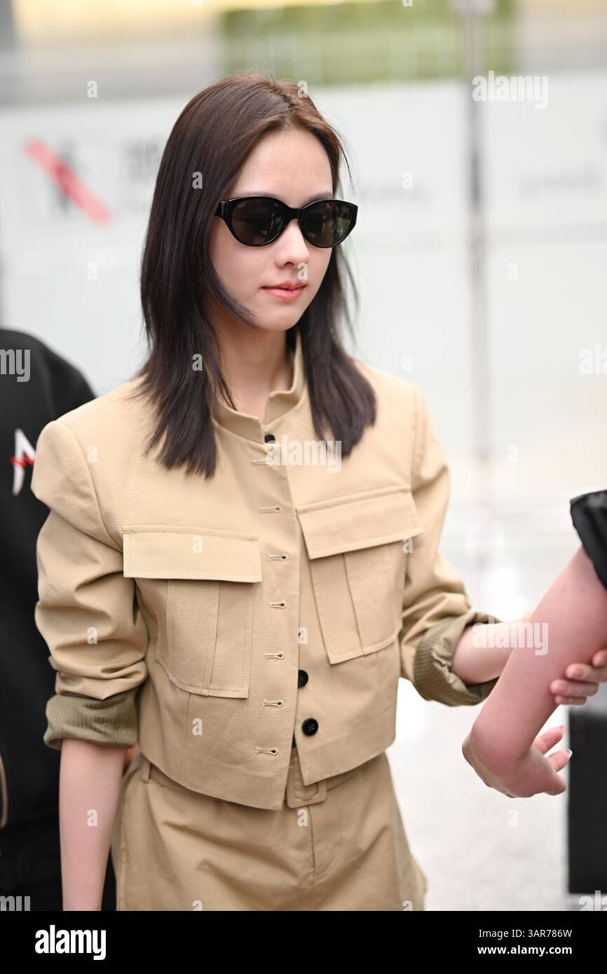 Chinese actress Chen Duling appears at the airport in Shanghai, China, 15 April, 2025 Stock ...