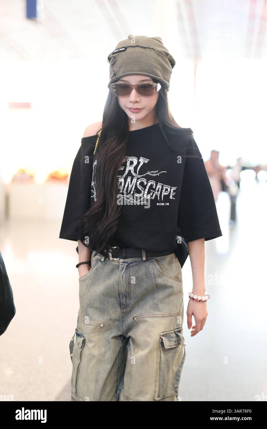 Chinese singer and actress Dai Yanni appears at the airport in Beijing ...