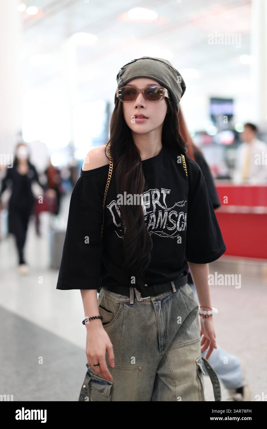 Chinese singer and actress Dai Yanni appears at the airport in Beijing ...