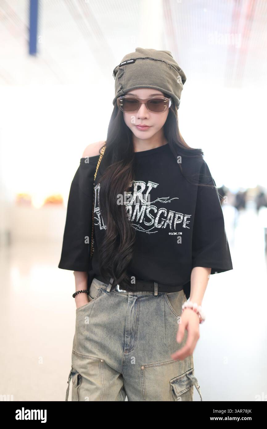 Chinese singer and actress Dai Yanni appears at the airport in Beijing ...