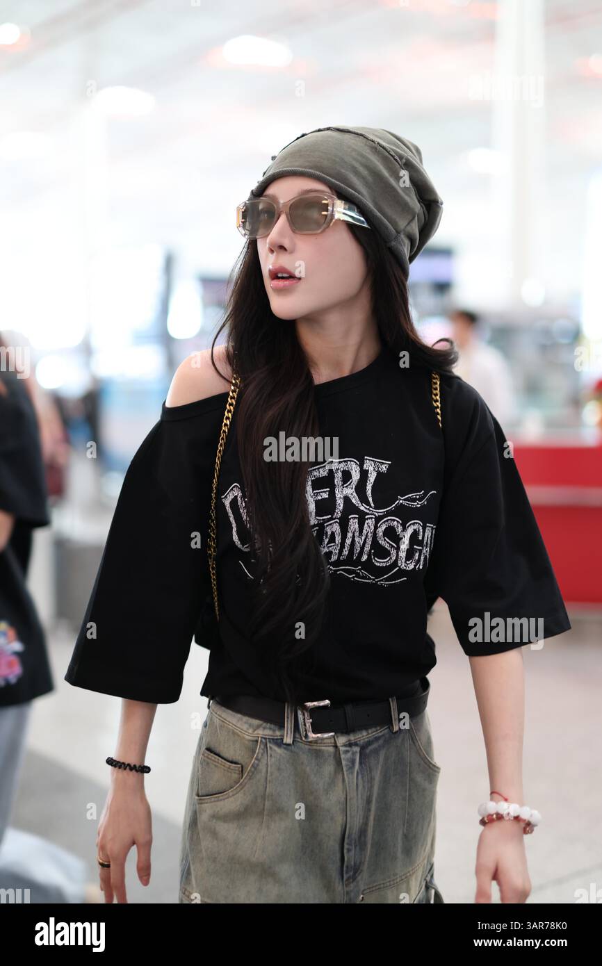 Chinese singer and actress Dai Yanni appears at the airport in Beijing ...