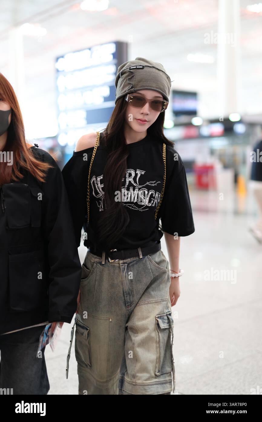 Chinese singer and actress Dai Yanni appears at the airport in Beijing ...