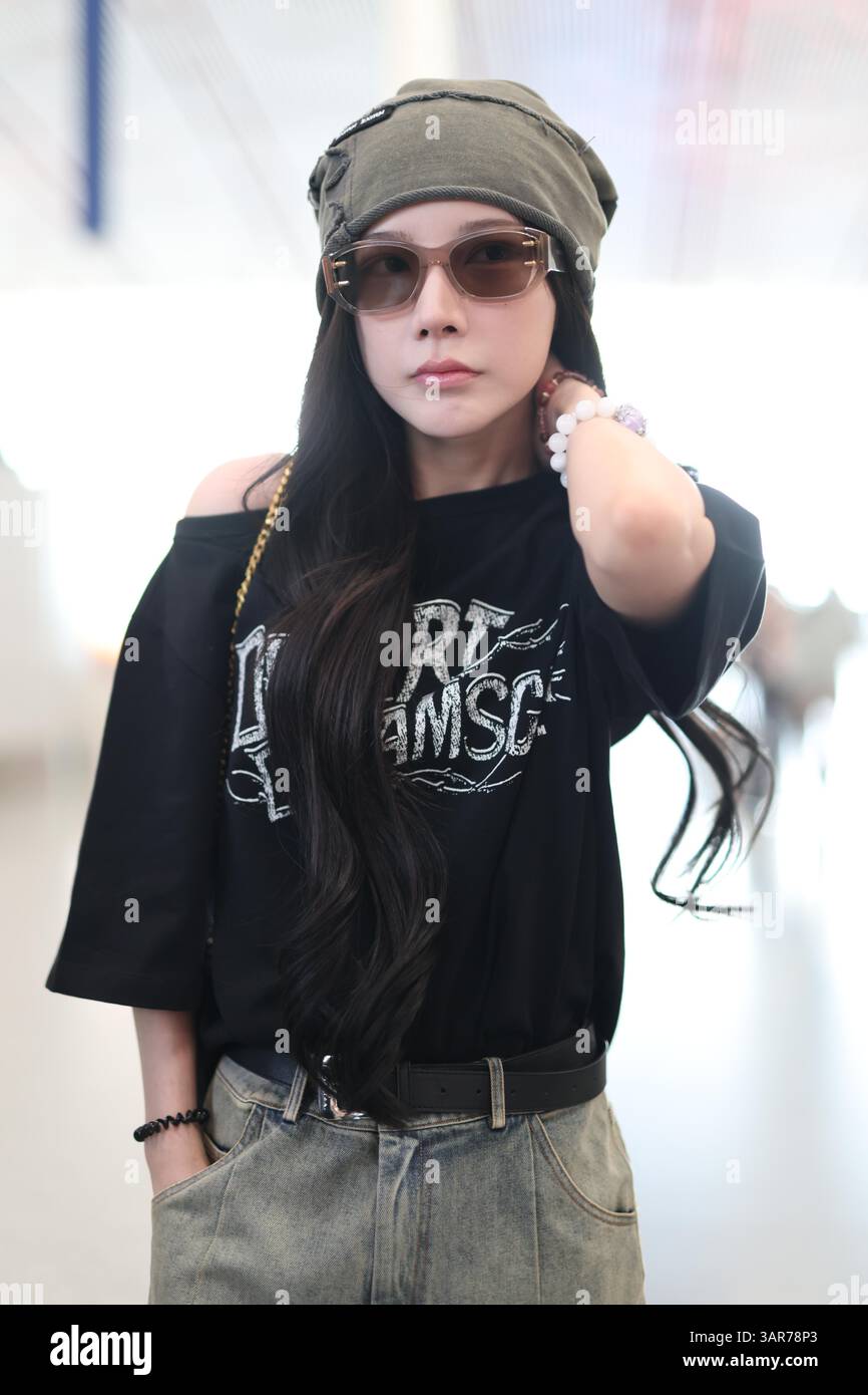Chinese singer and actress Dai Yanni appears at the airport in Beijing ...