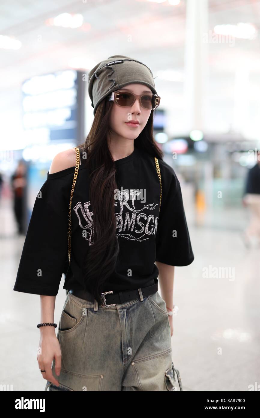 Chinese singer and actress Dai Yanni appears at the airport in Beijing ...