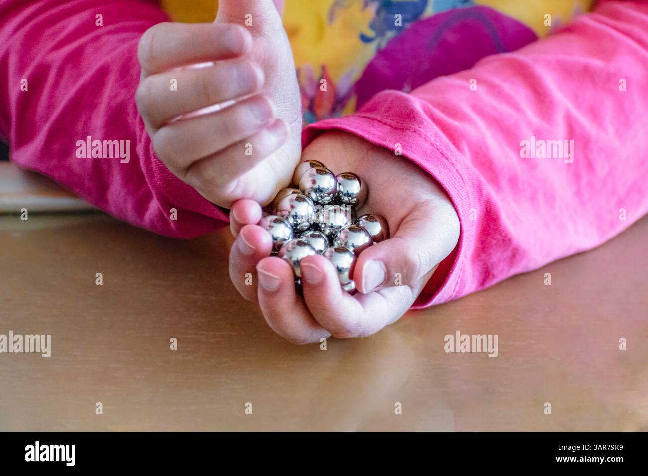 Child having fun with an authentic leisure activity, fine motor skills ...