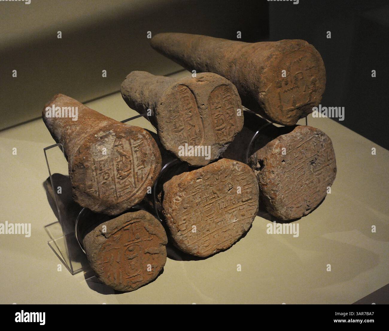 Ancient Egypt. Funerary cones made of clay. The name and titles of the ...