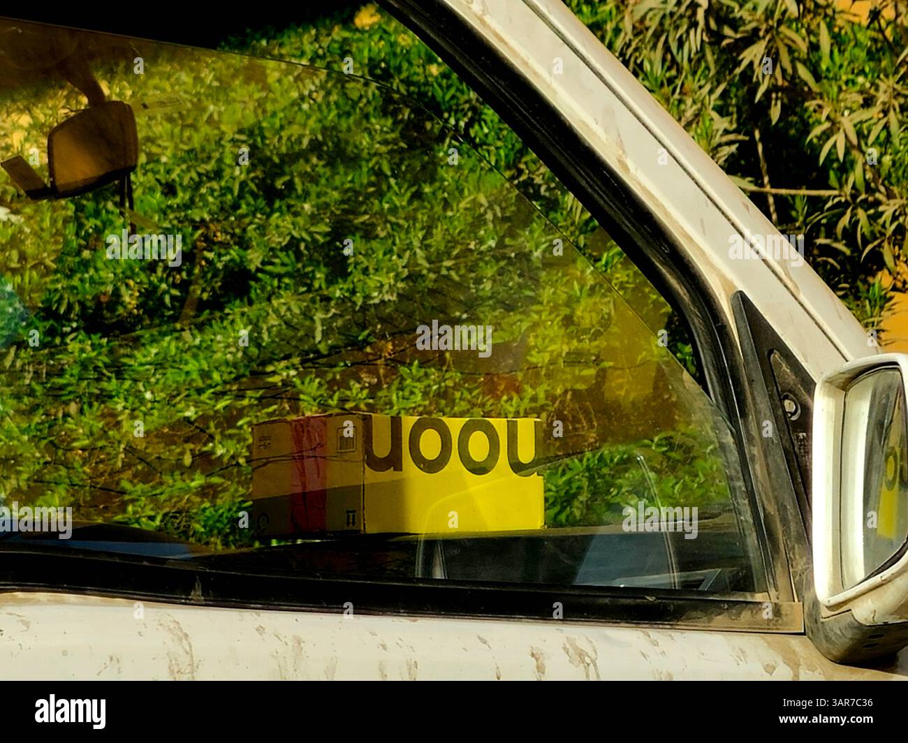 Cairo, Egypt, March 26 2025: Noon online shopping delivery yellow box ...