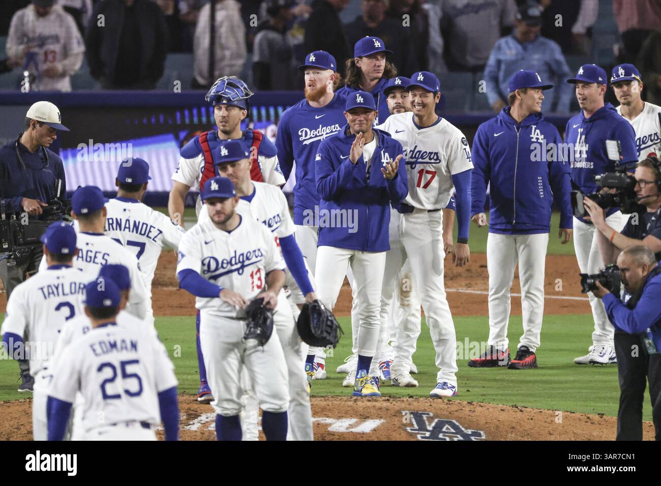 Los Angeles Dodgers players high-five each other after the team beat ...