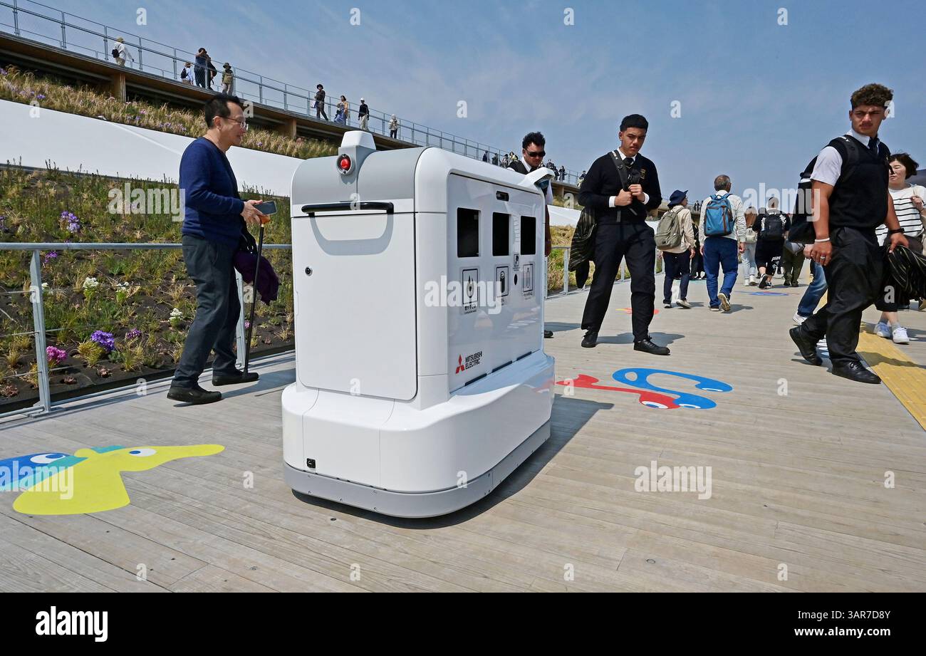 A robot for garbage moves automatically around the Grand Ring for Expo ...