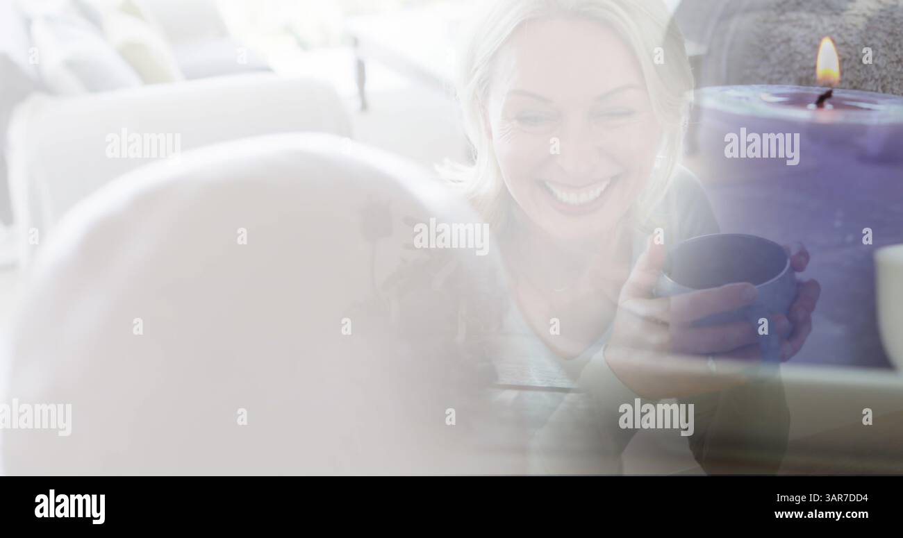 Image of happy diverse couple drinking coffee over candles Stock Photo ...