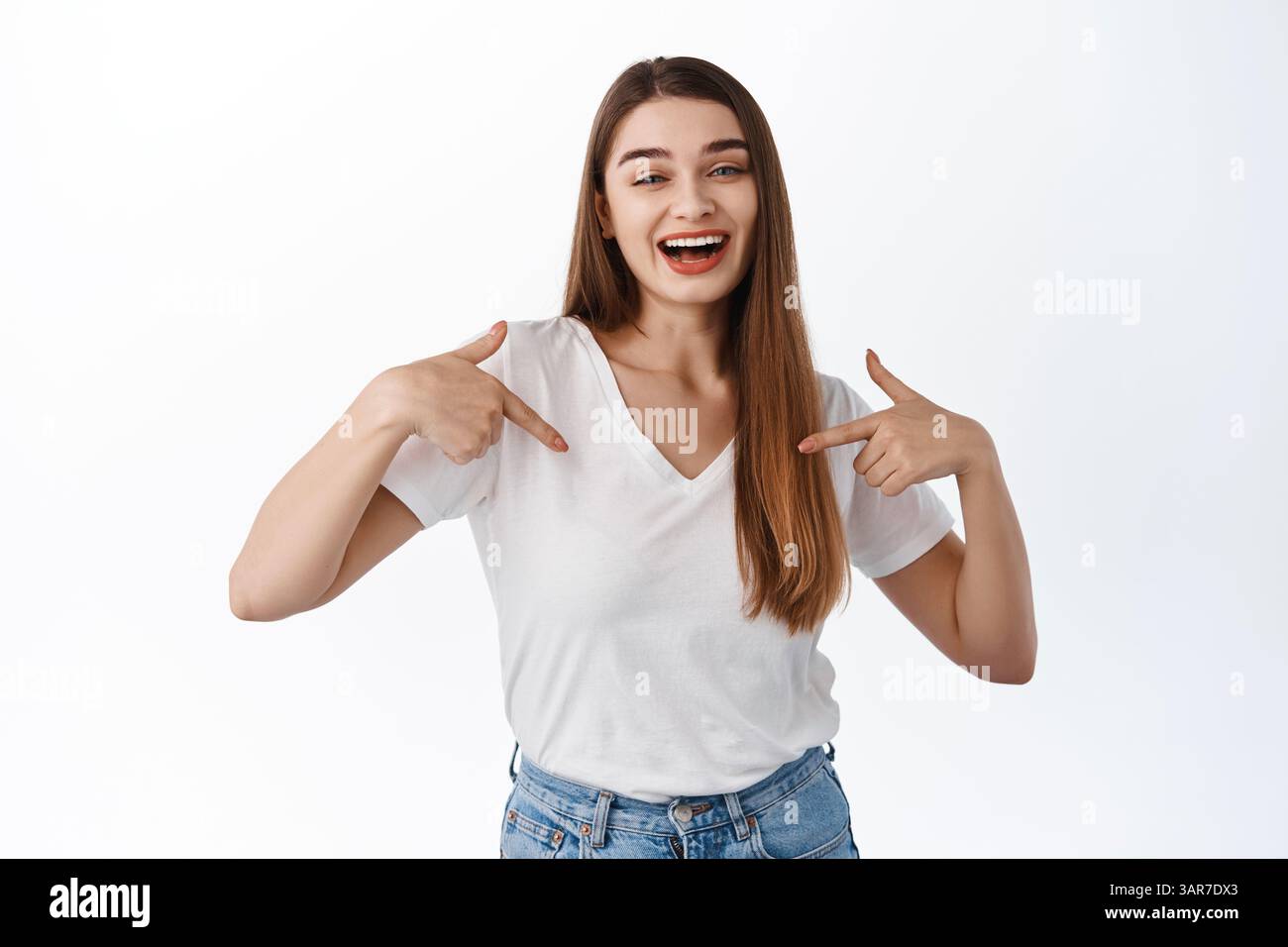 Smiling beautiful girl pointing at herself with self-assured, confident ...